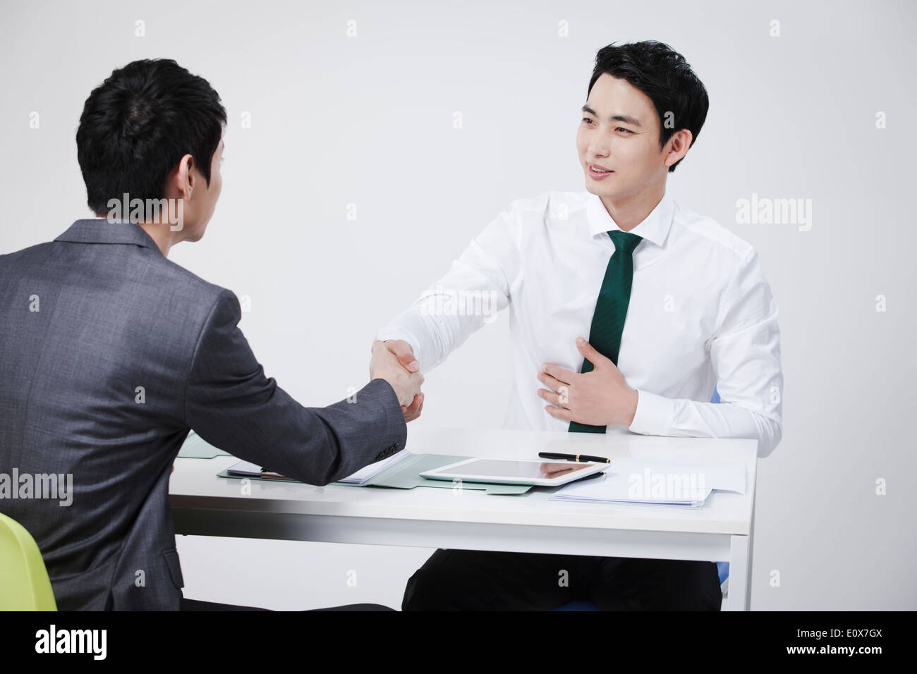 two business men shaking hands Stock Photo - Alamy