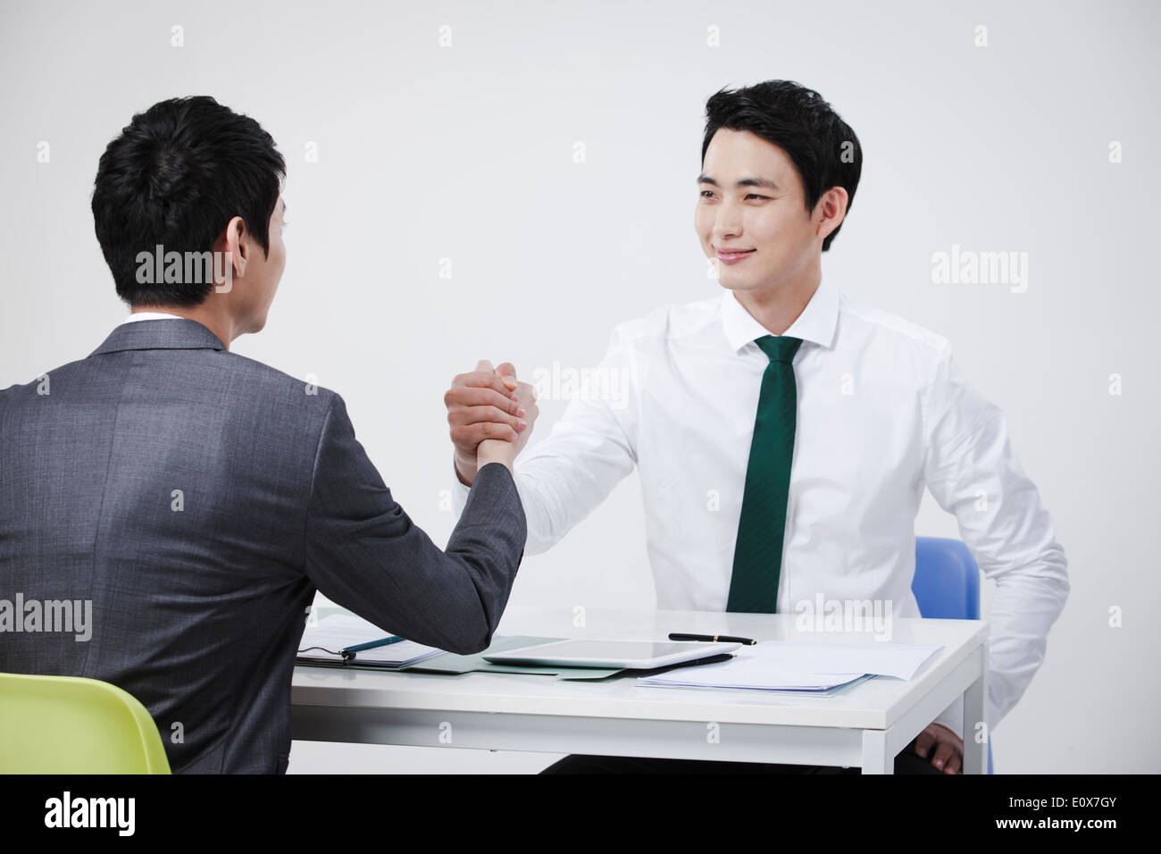 two business men shaking hands Stock Photo - Alamy
