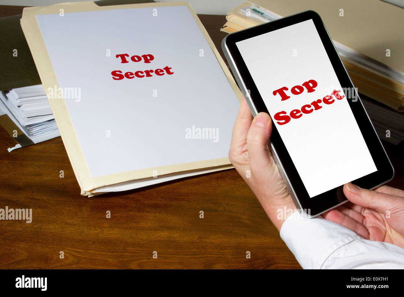 Woman using tablet device to photograph corporate secrets Stock Photo ...