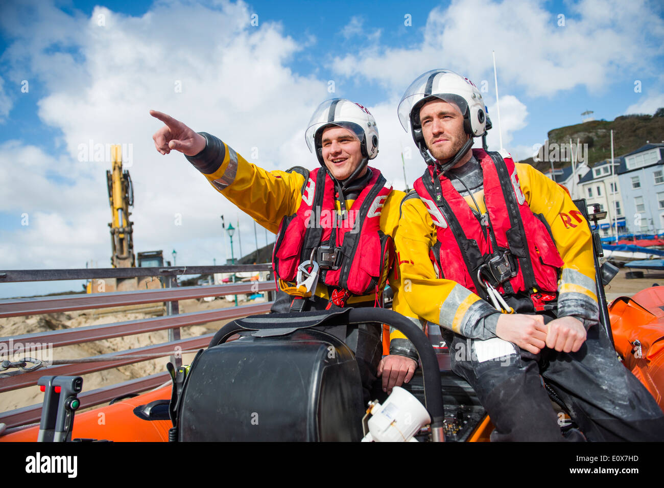 Two RNLI Royal National Lifeboat Institution volunteer crew members ...