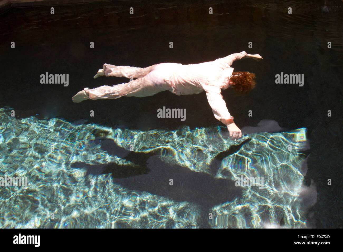 Woman drowned and floating in swimming pool Stock Photo - Alamy