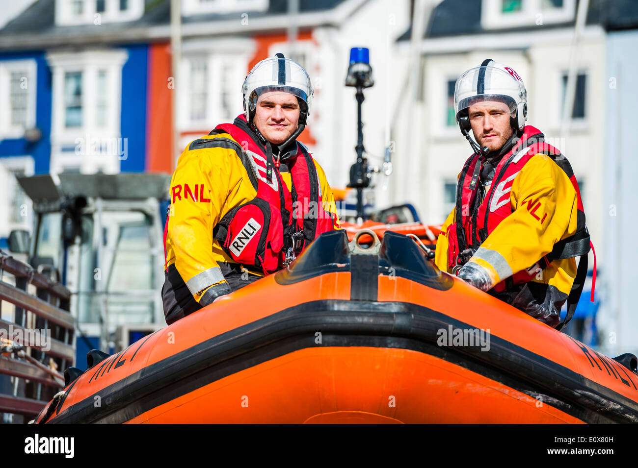 Two RNLI Royal National Lifeboat Institution volunteer crew members ...