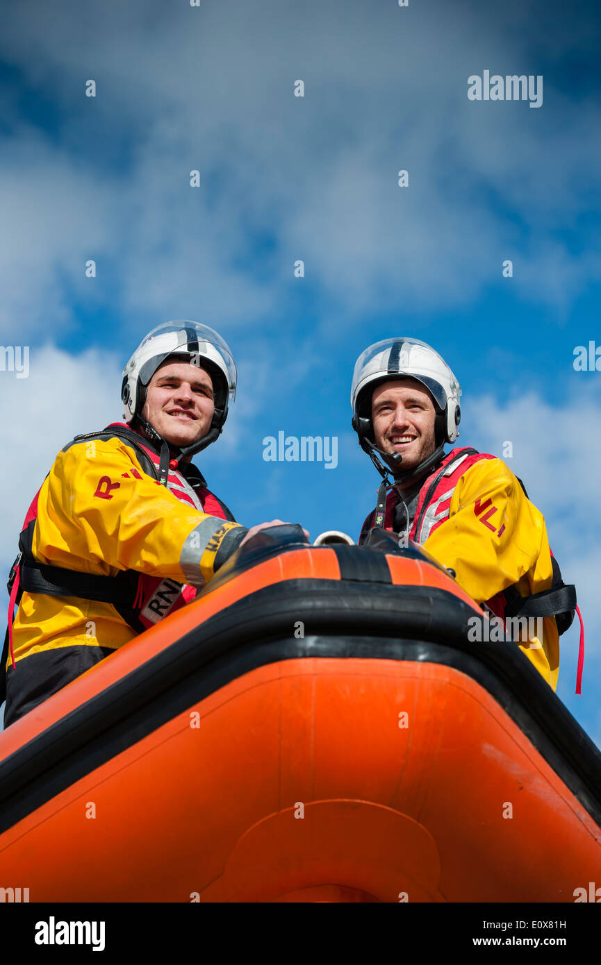Two RNLI Royal National Lifeboat Institution volunteer crew members ...