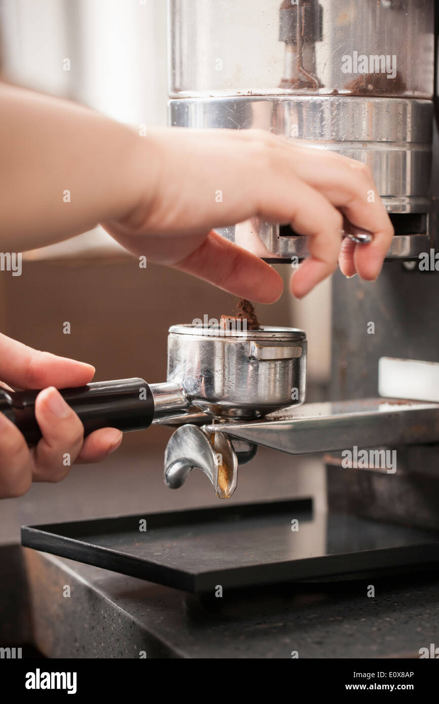 a person operating a espresso machine Stock Photo - Alamy