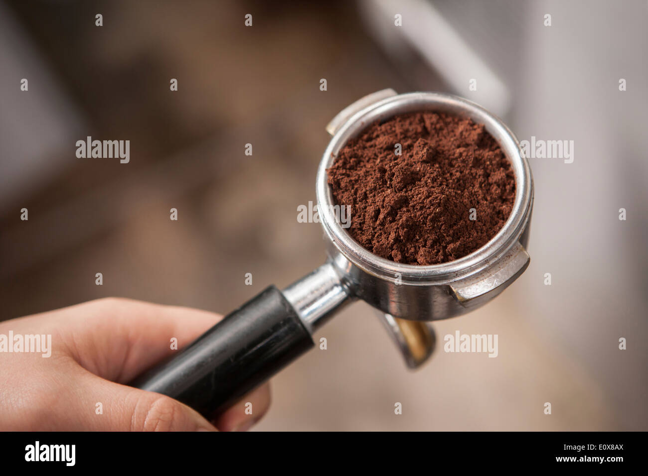 a person operating a espresso machine Stock Photo - Alamy