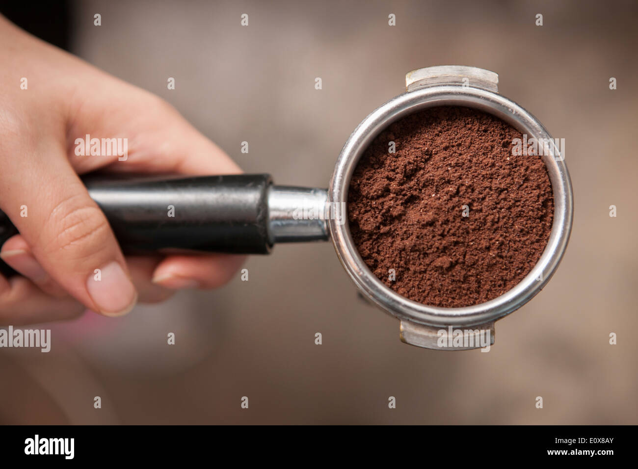 a person operating a espresso machine Stock Photo - Alamy