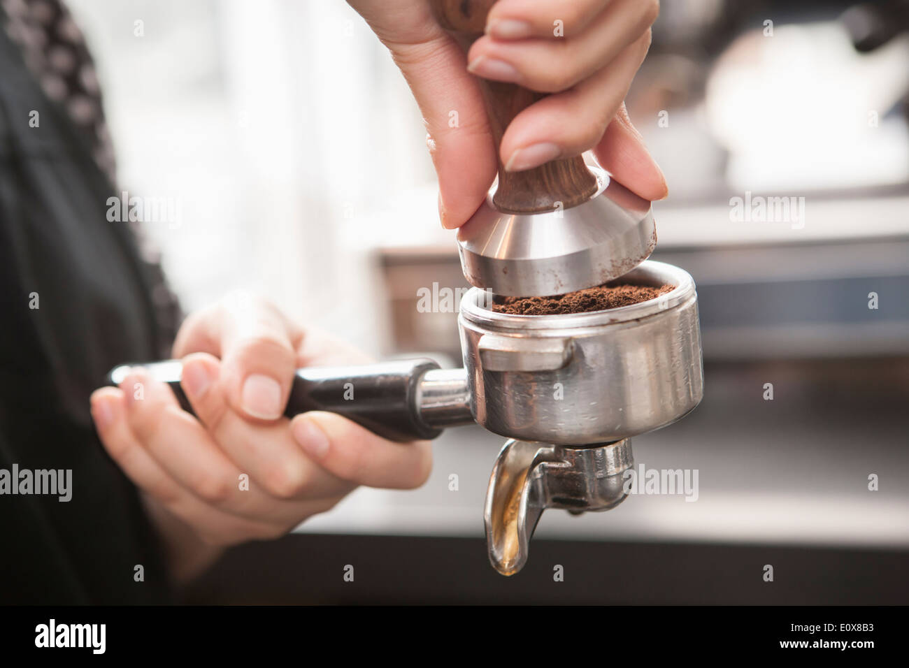 a person operating a espresso machine Stock Photo - Alamy