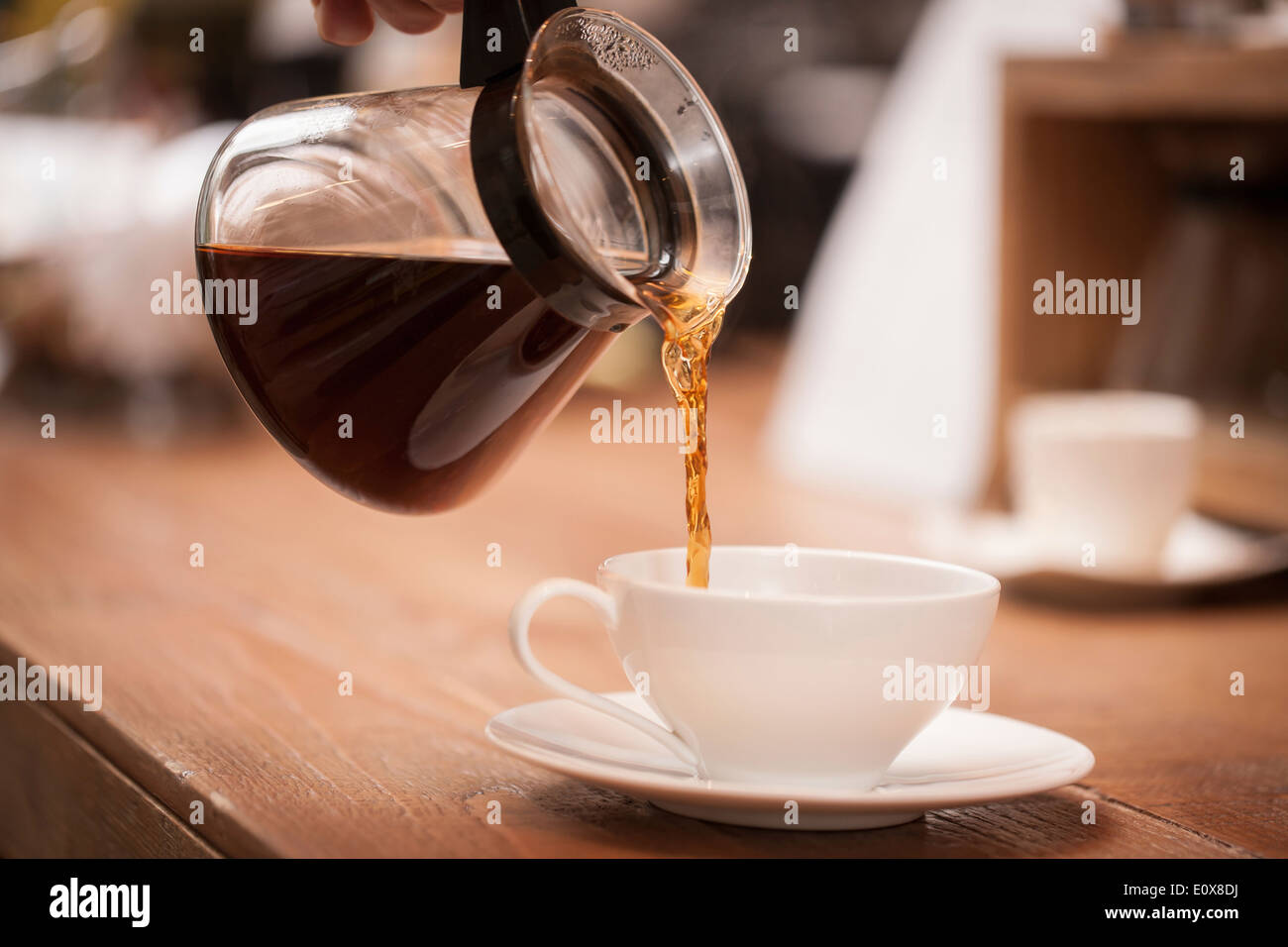 coffee being poured into a cup Stock Photo - Alamy