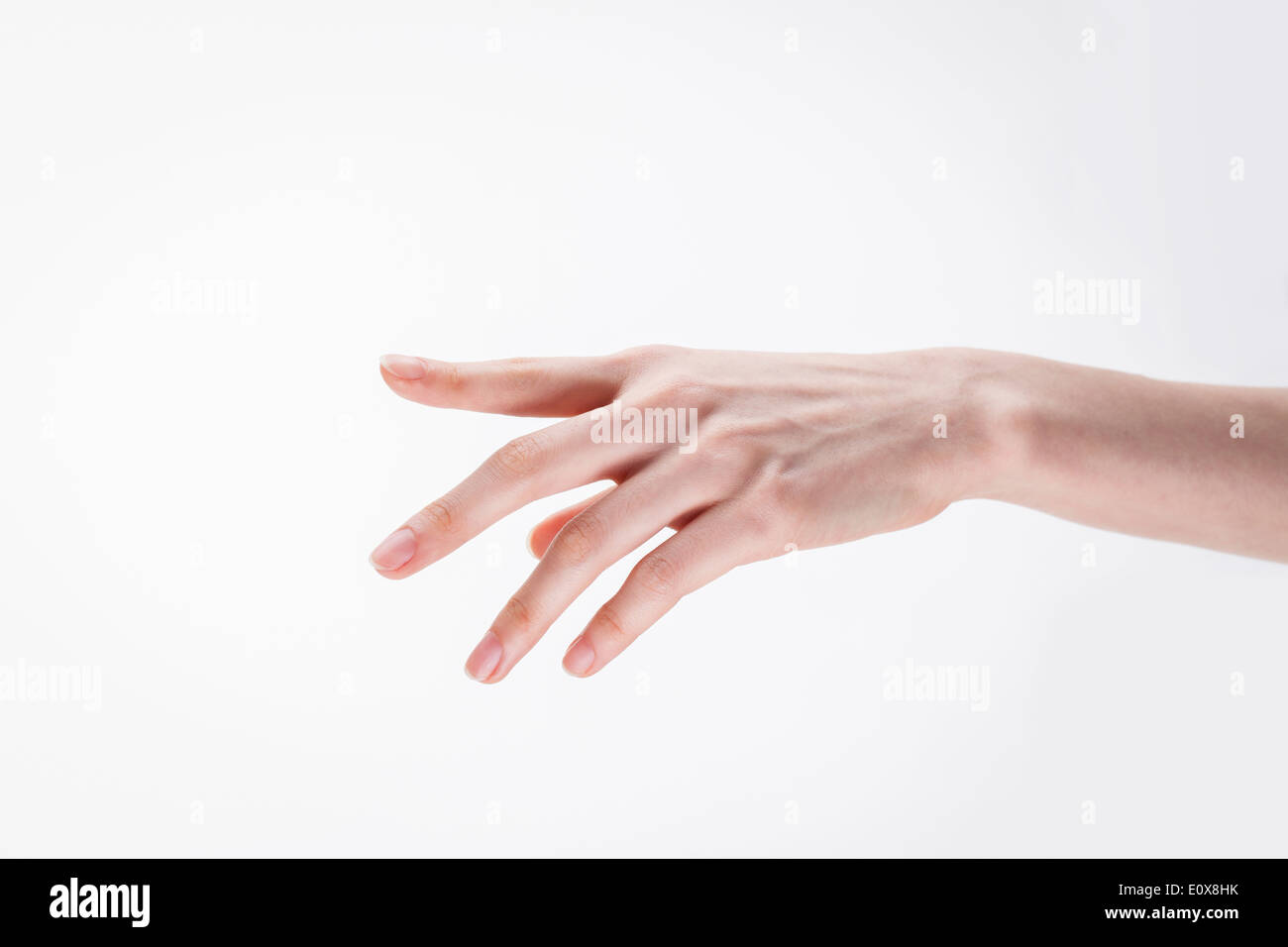 a woman holding her hand palm down Stock Photo - Alamy