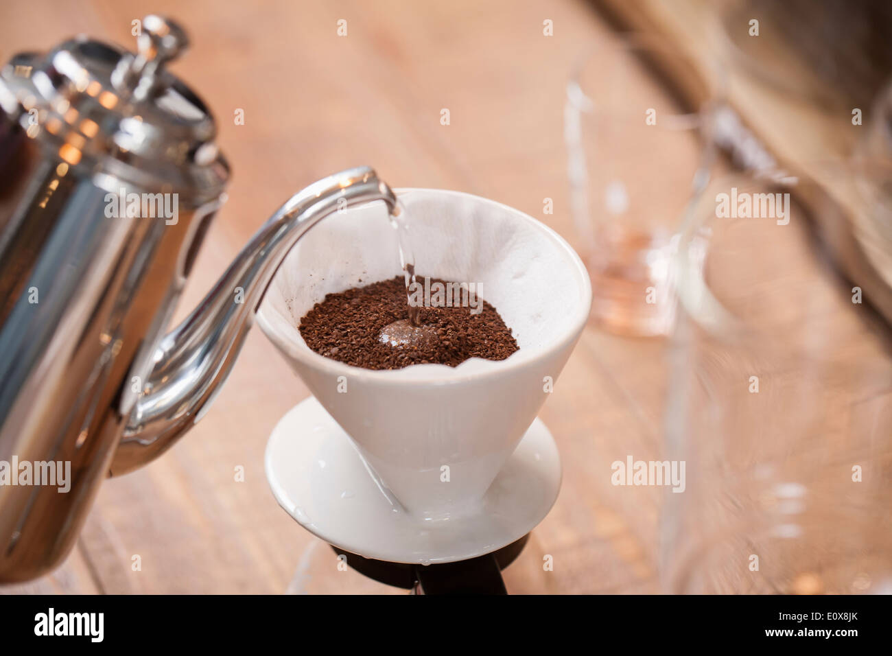water poured into a filter with coffee Stock Photo - Alamy