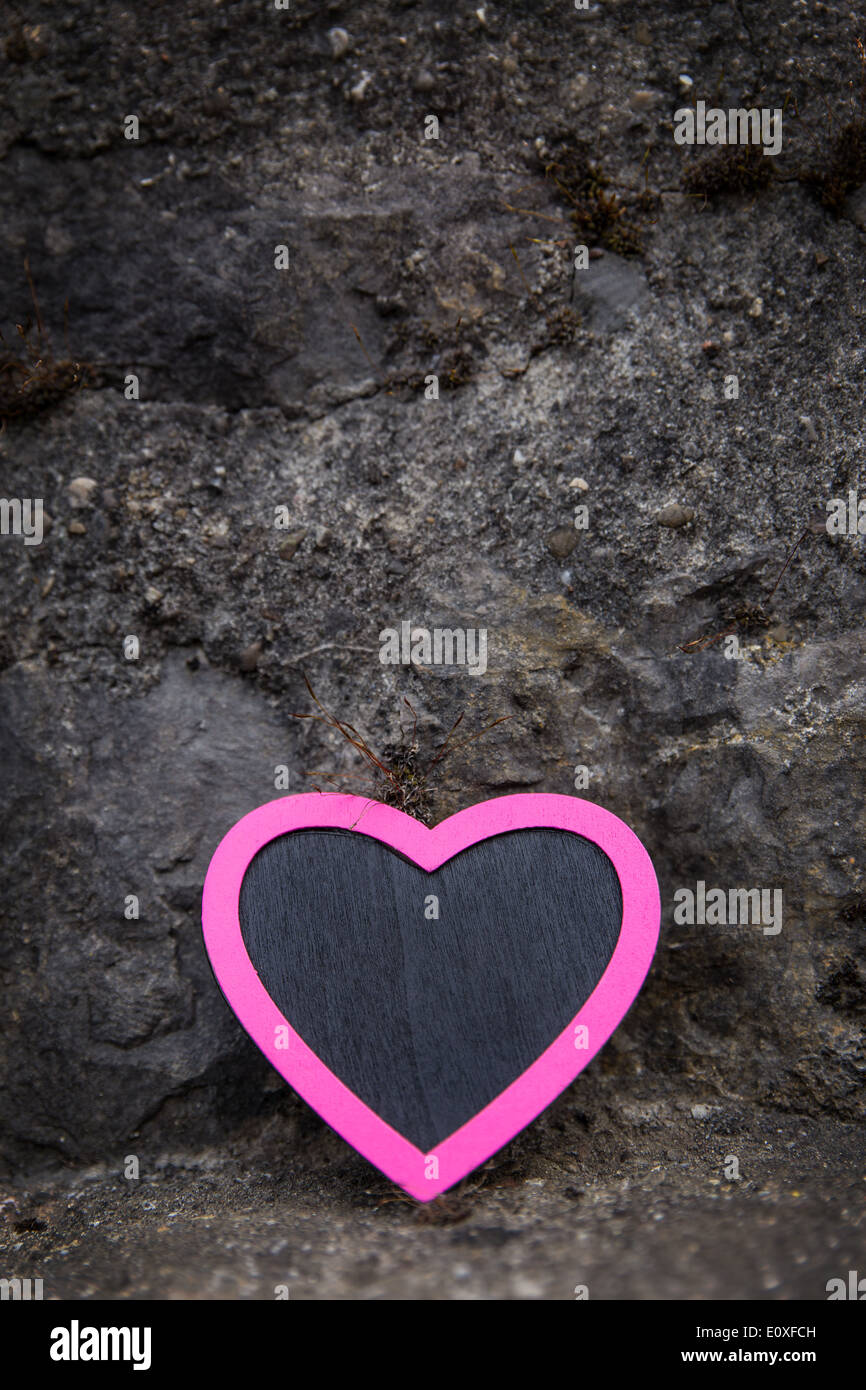a rocky background and pink heart with copy space Stock Photo - Alamy