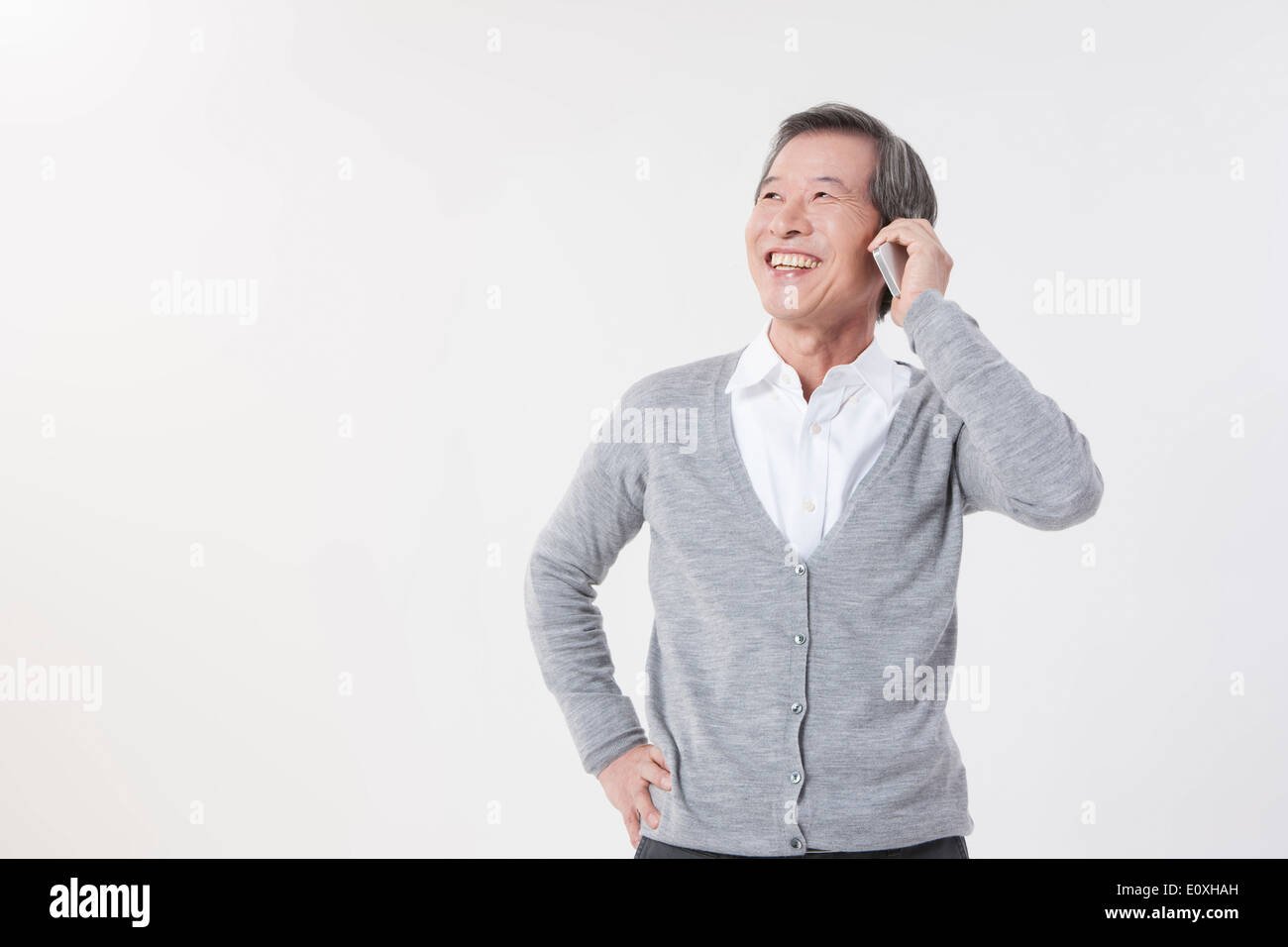 an old man using a smart phone Stock Photo - Alamy