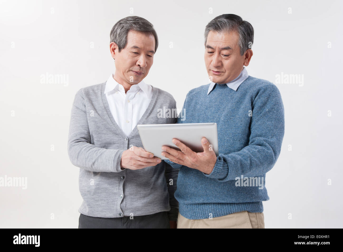 Old man tablet hi-res stock photography and images - Alamy