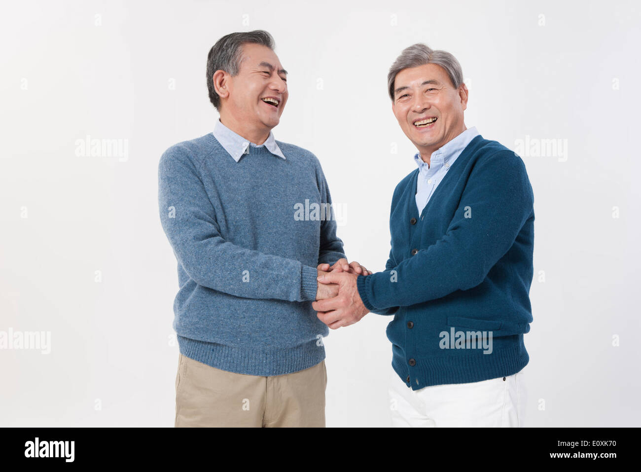 two old men shaking hands Stock Photo - Alamy