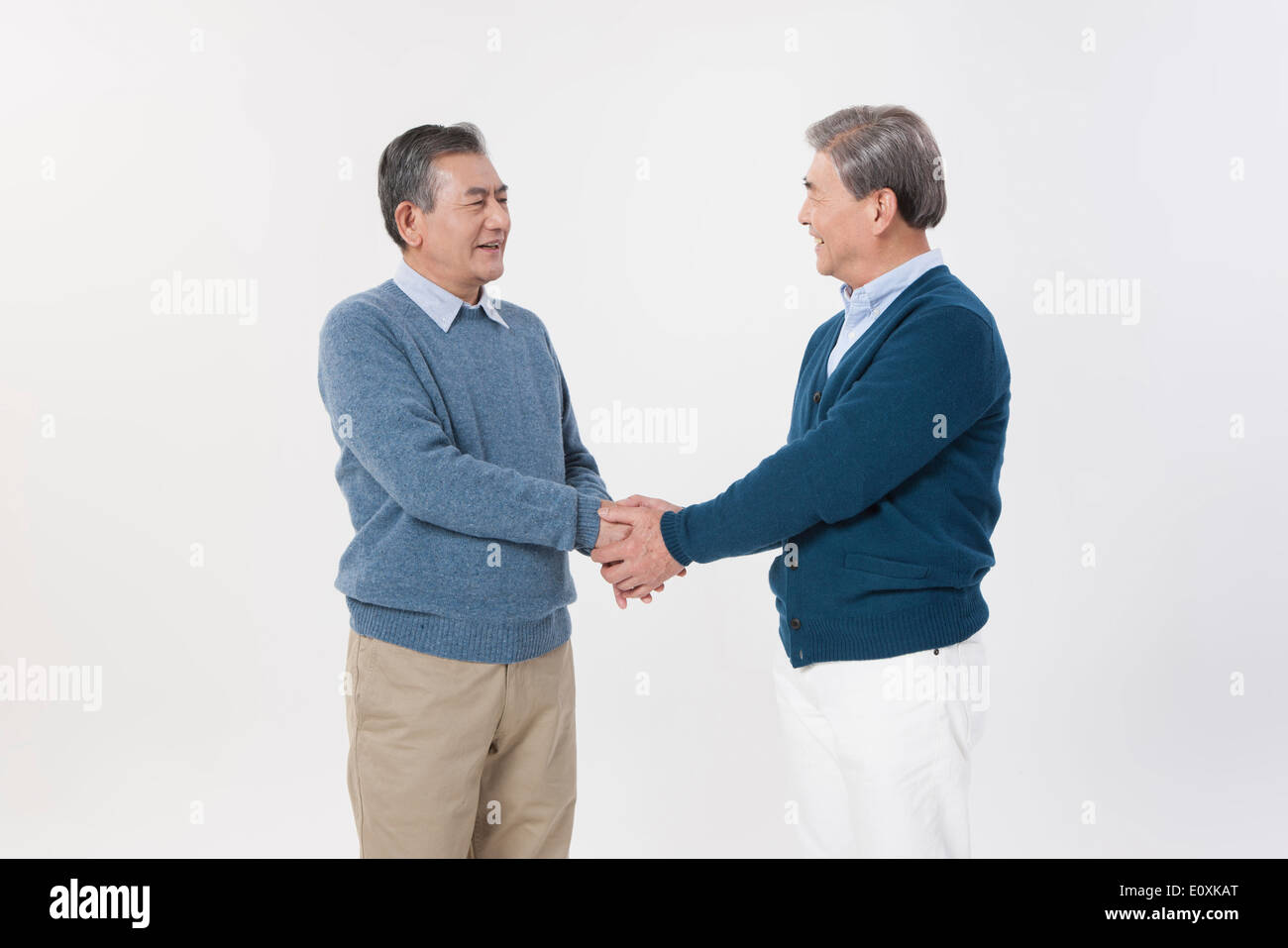 two old men shaking hands Stock Photo - Alamy