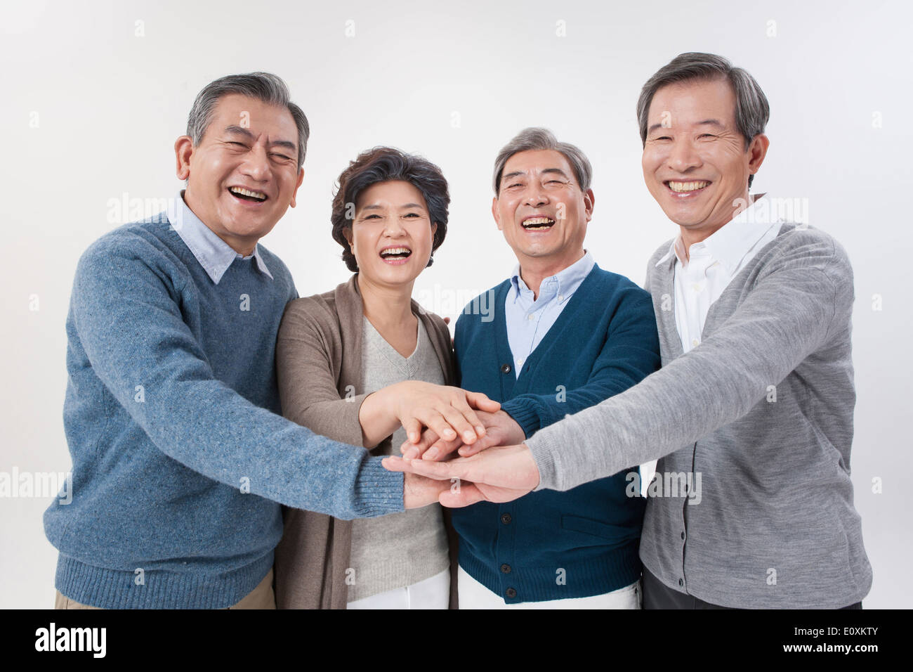 a group of old people holding hands Stock Photo - Alamy
