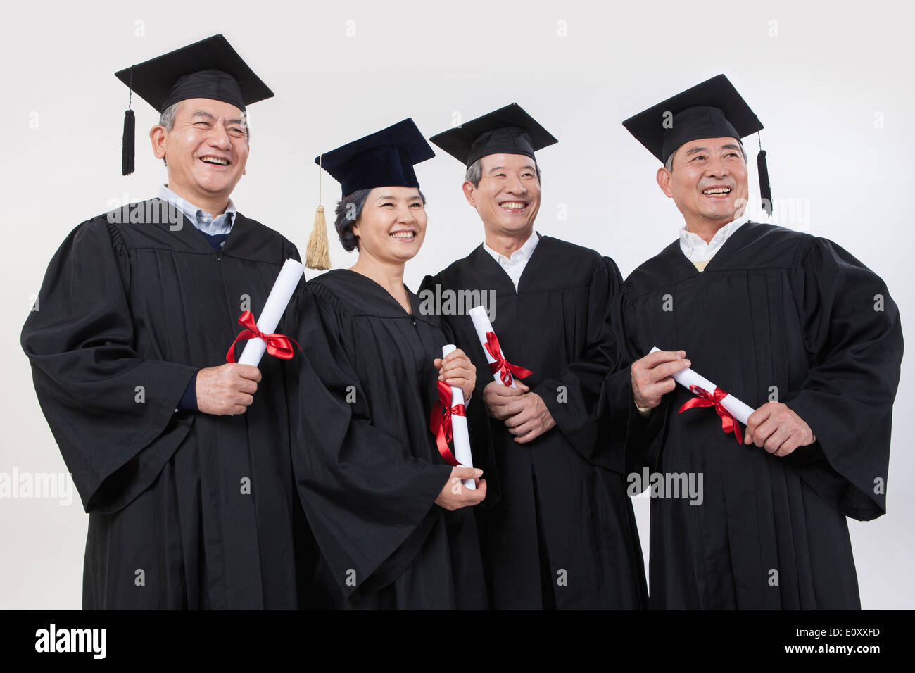 old people posing in graduation outfits Stock Photo - Alamy