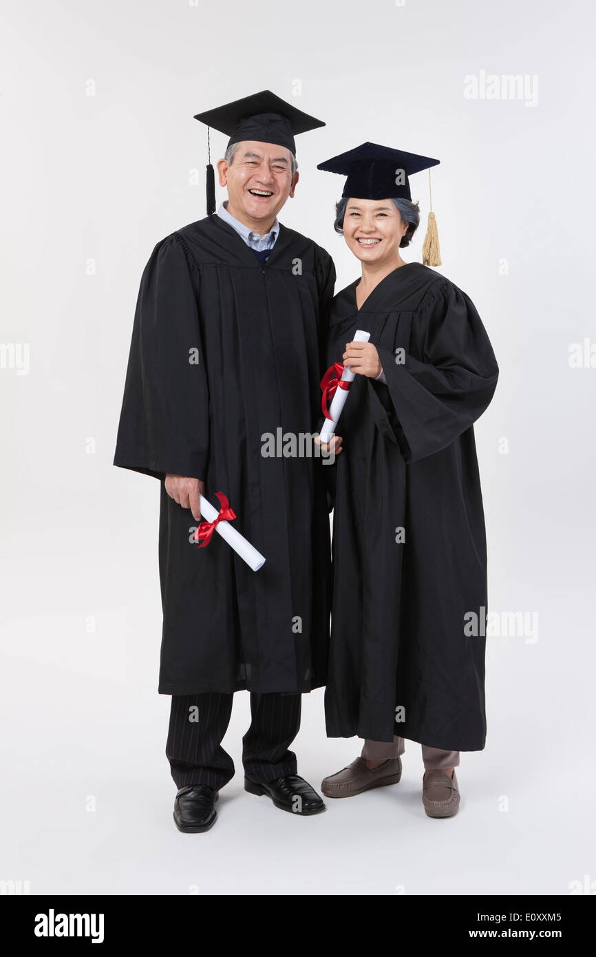 old people posing in graduation outfits Stock Photo - Alamy