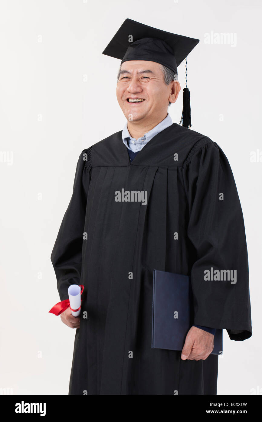 an old man posing in a graduation outfit Stock Photo - Alamy