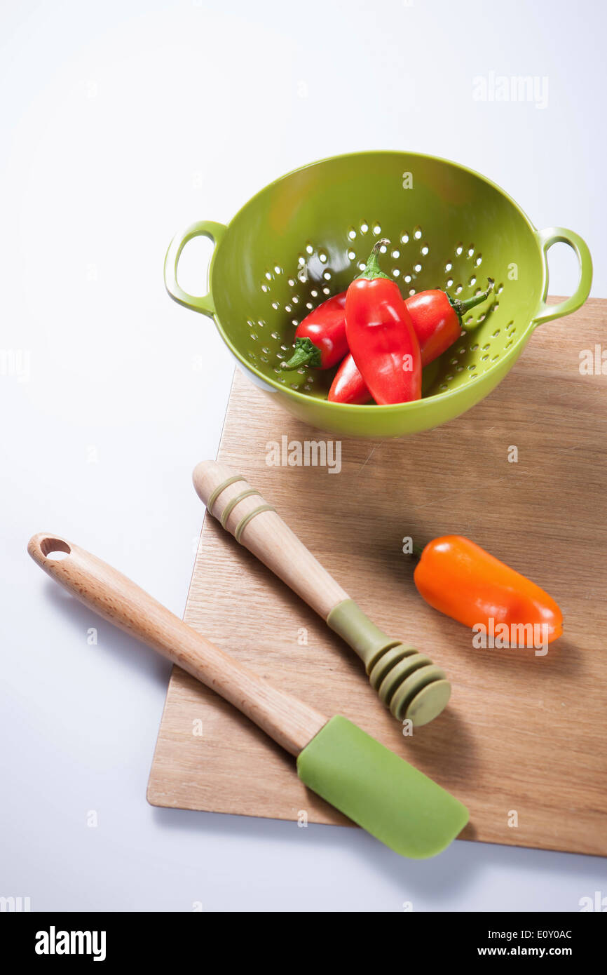 a cutting board with cooking tools Stock Photo - Alamy