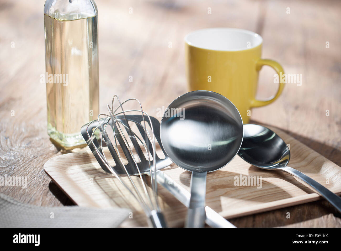 a set of metal color kitchen tools on a table Stock Photo - Alamy