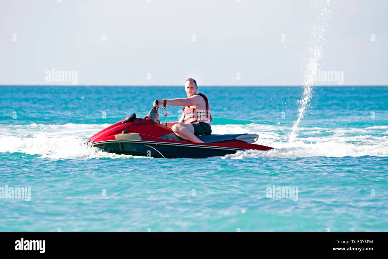 Young guy cruising on the atlantic ocean on a jet ski Stock Photo - Alamy