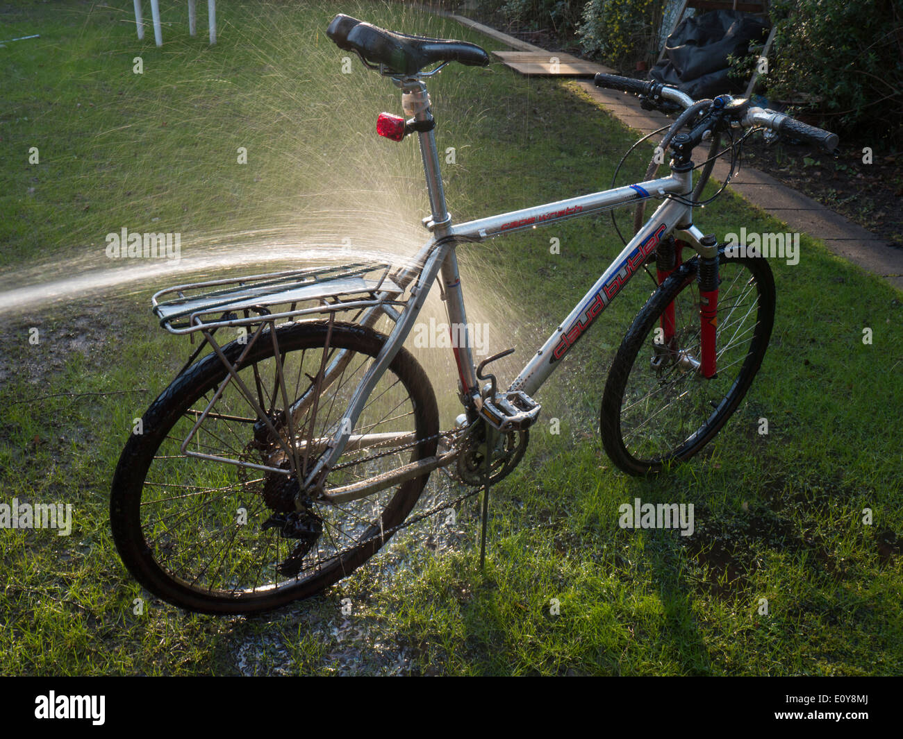Cycle washing with hose Stock Photo - Alamy