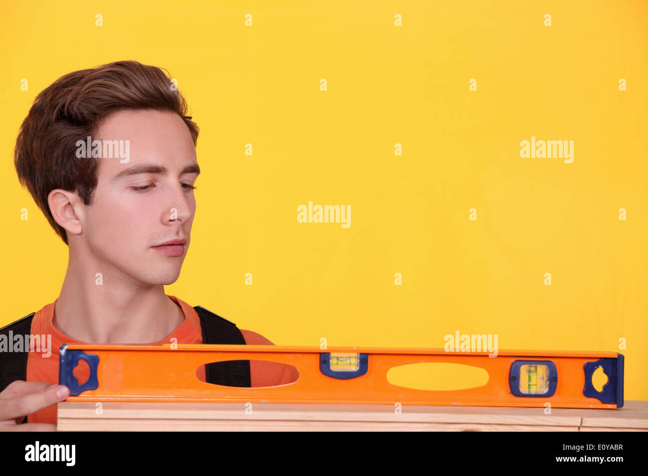 Craftsman with spirit-level Stock Photo - Alamy