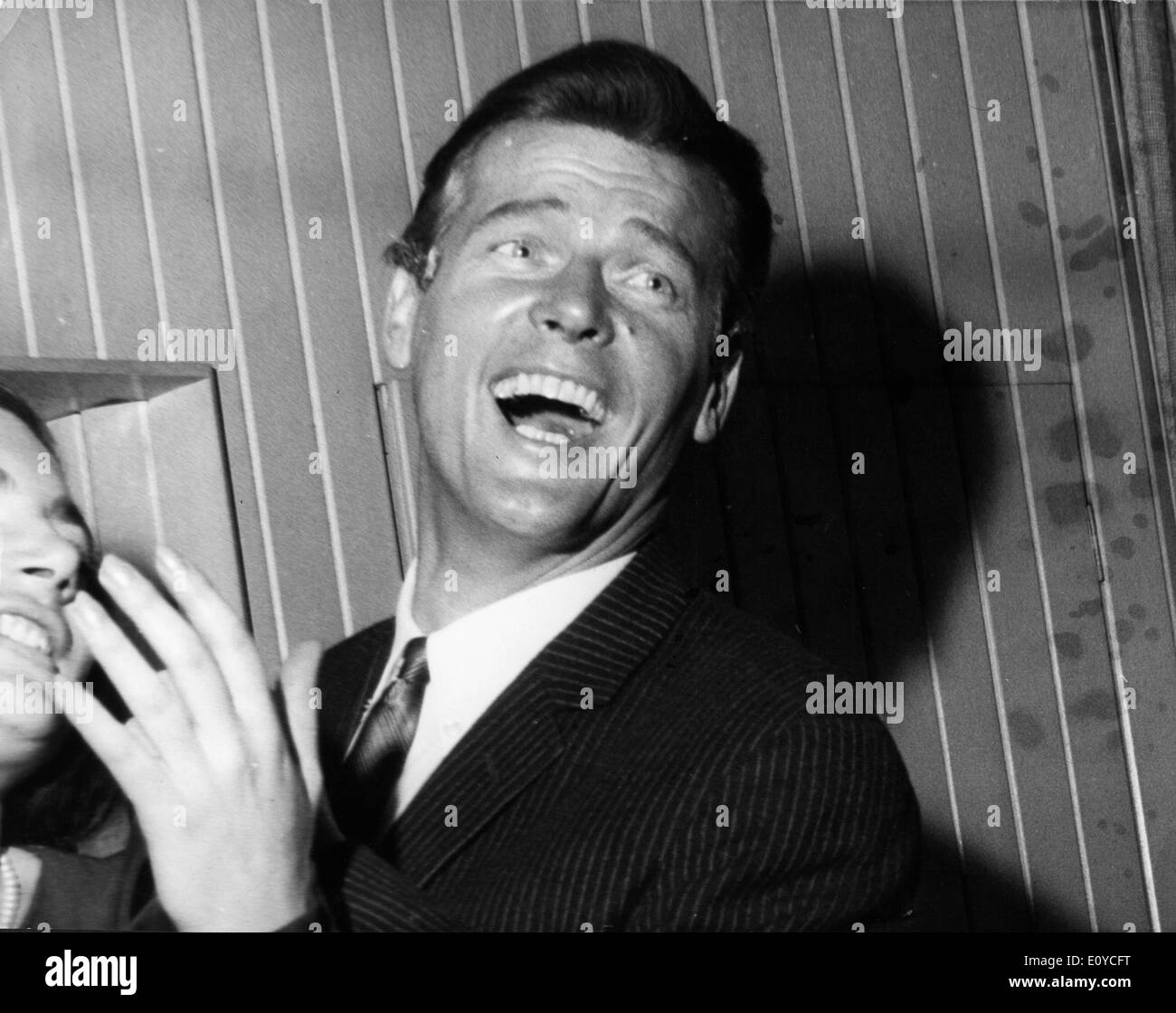 Actor Roger Moore laughing Stock Photo - Alamy