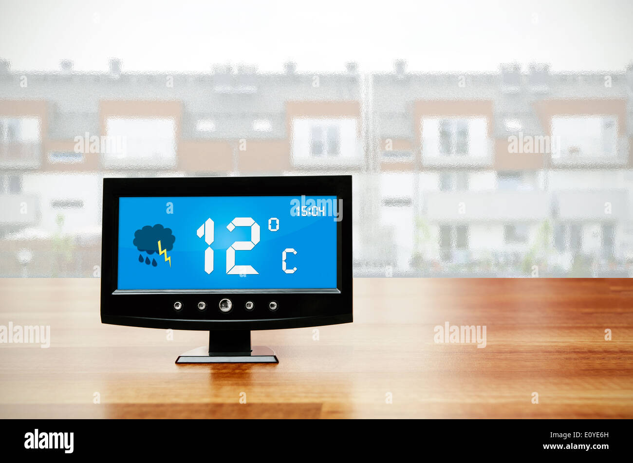 Weather station device with weather conditions outside background Stock ...