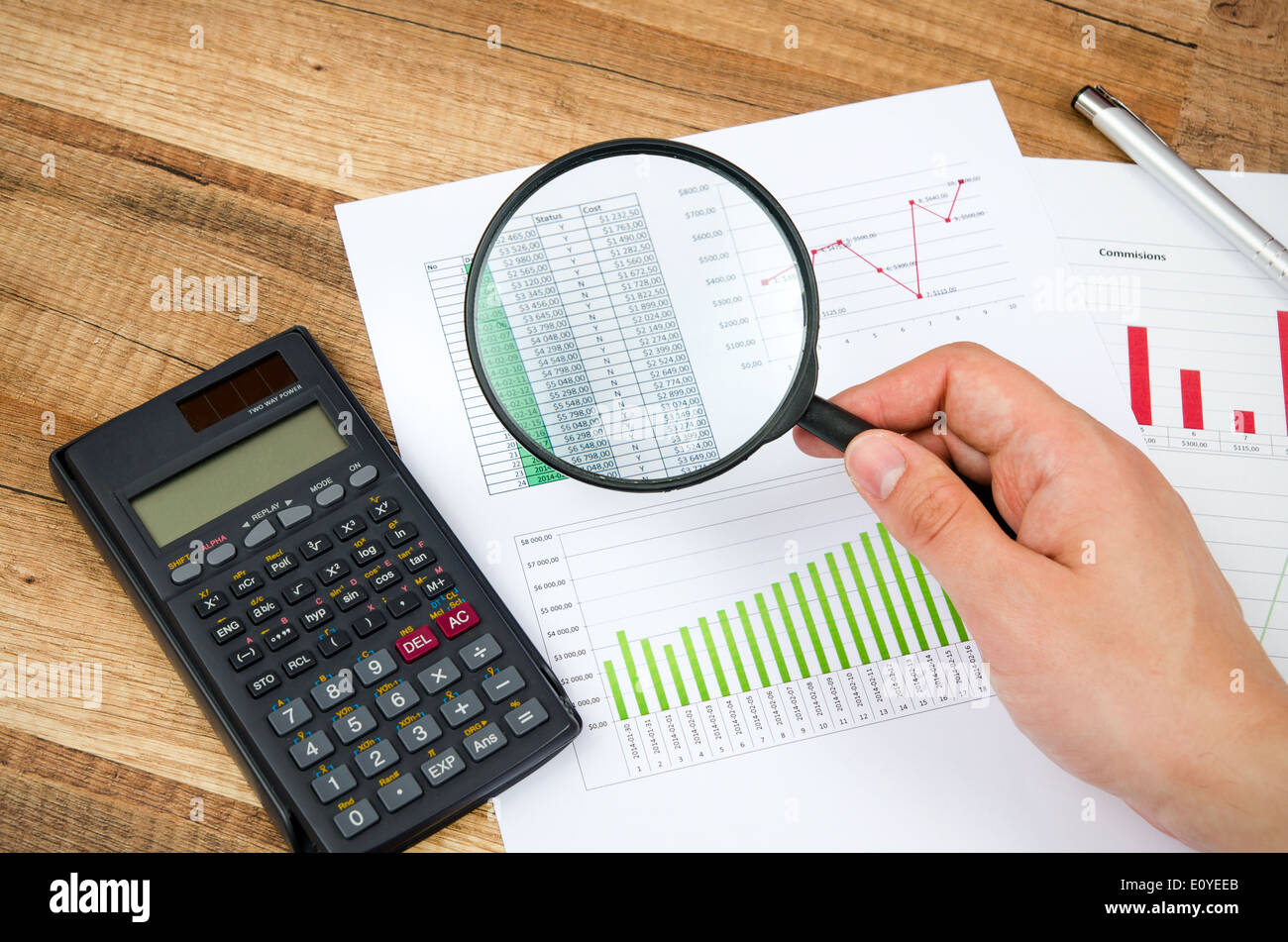 Magnifier on business background. Use for company strategic behavior ...