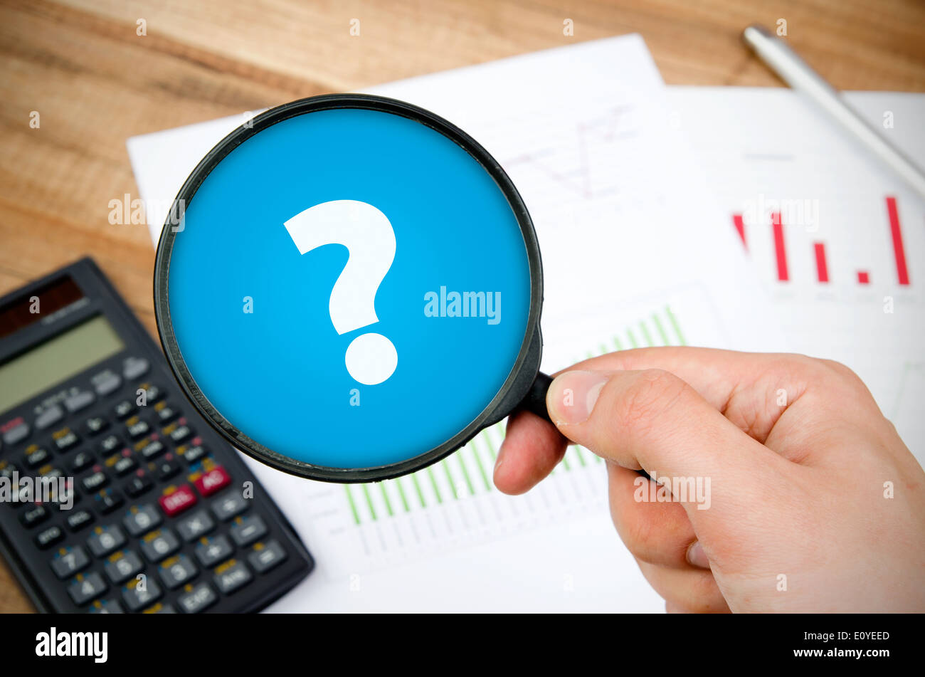 Magnifier on business background. Use for company strategic behavior ...