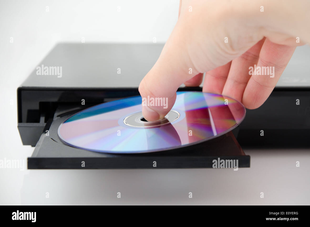 Disc insterted to DVD or CD player Stock Photo - Alamy