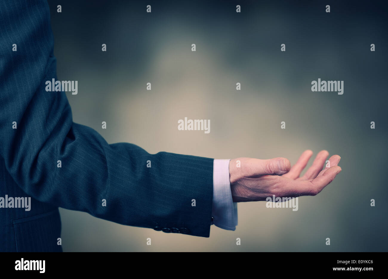 A businessman reaching out to offer assistance Stock Photo - Alamy