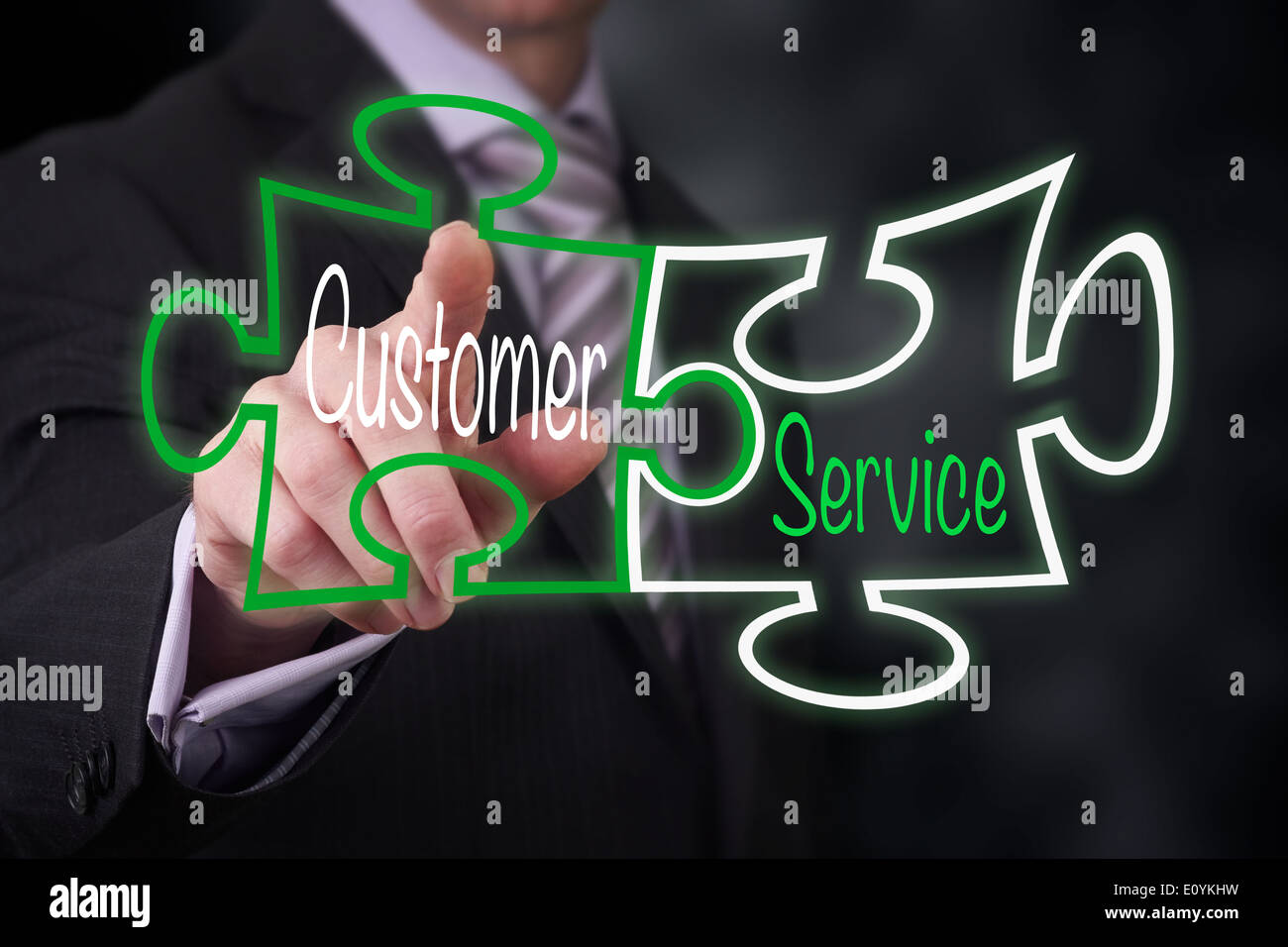 A Businessman pointing at a customer service puzzle concept Stock Photo ...