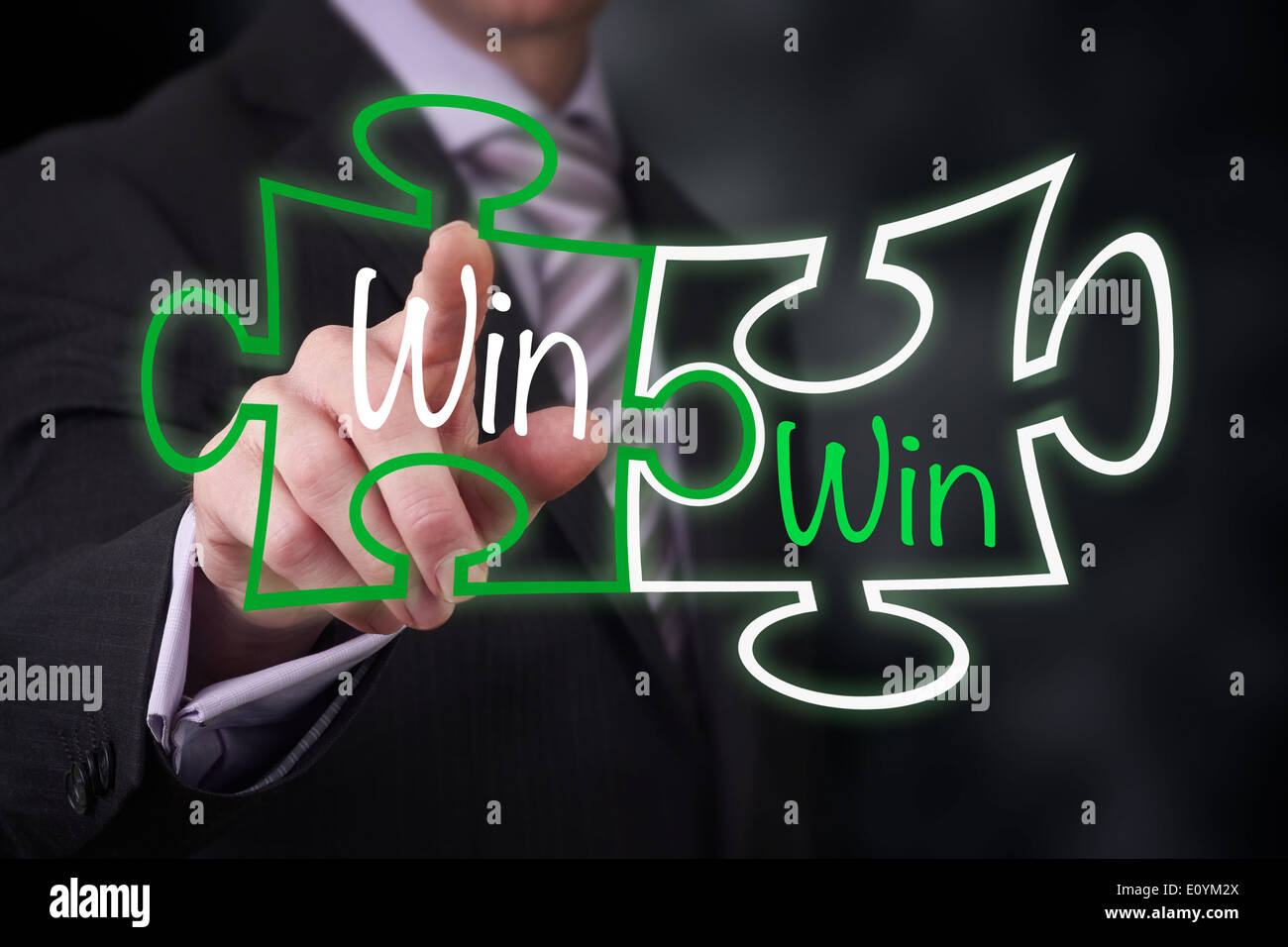 A Businessman Pointing at a Win Win Success puzzle concept Stock Photo ...