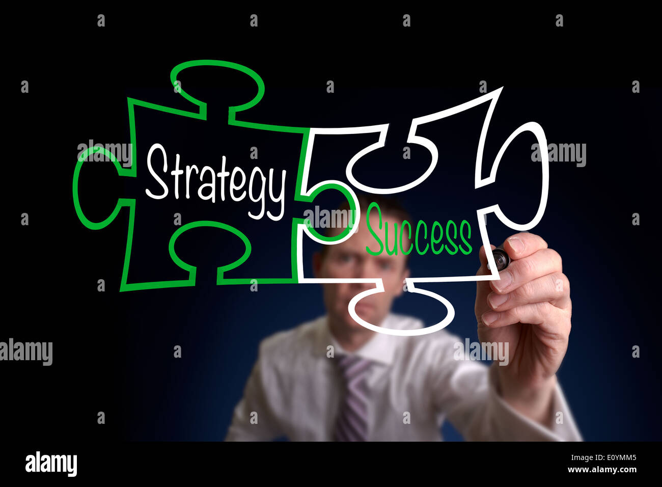 A Businessman drawing a strategy success puzzle concept Stock Photo - Alamy