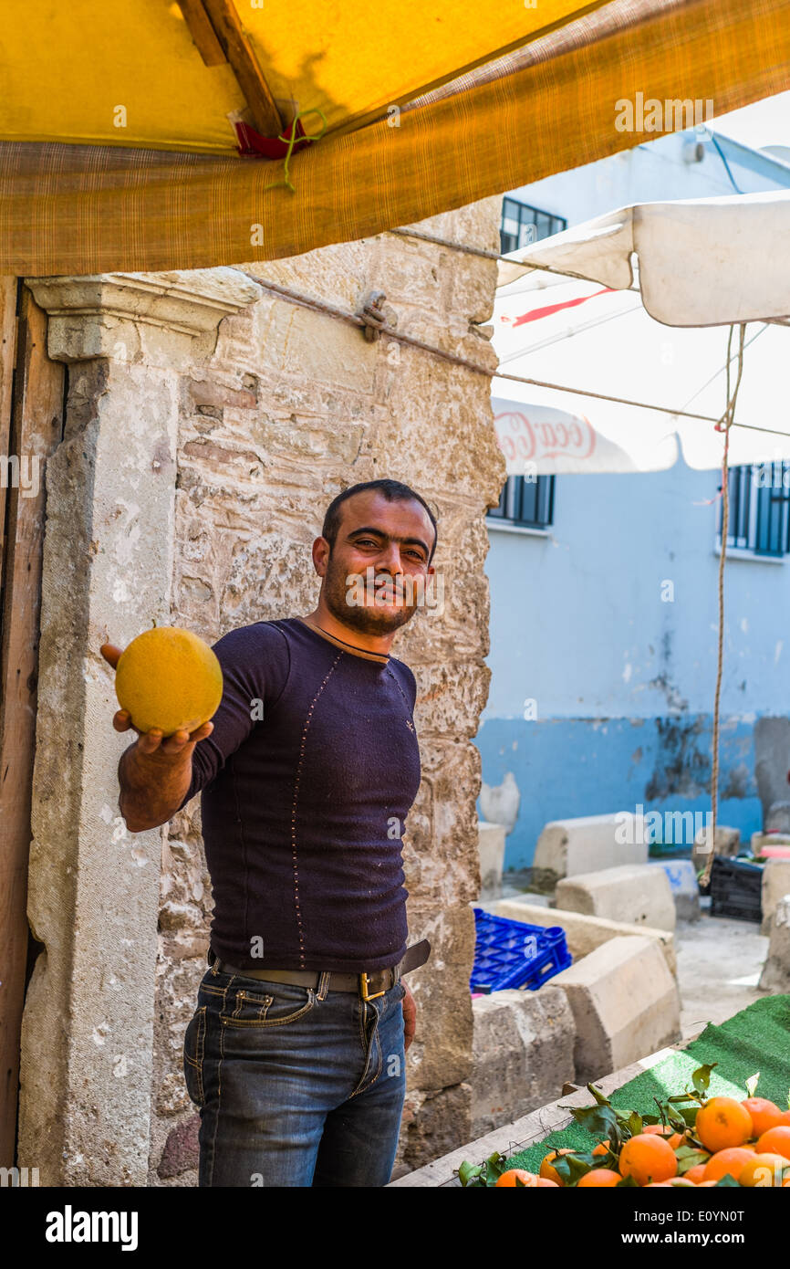 The weekly Tuesday market in Foca, Izmir District, Turkey, stall holder ...
