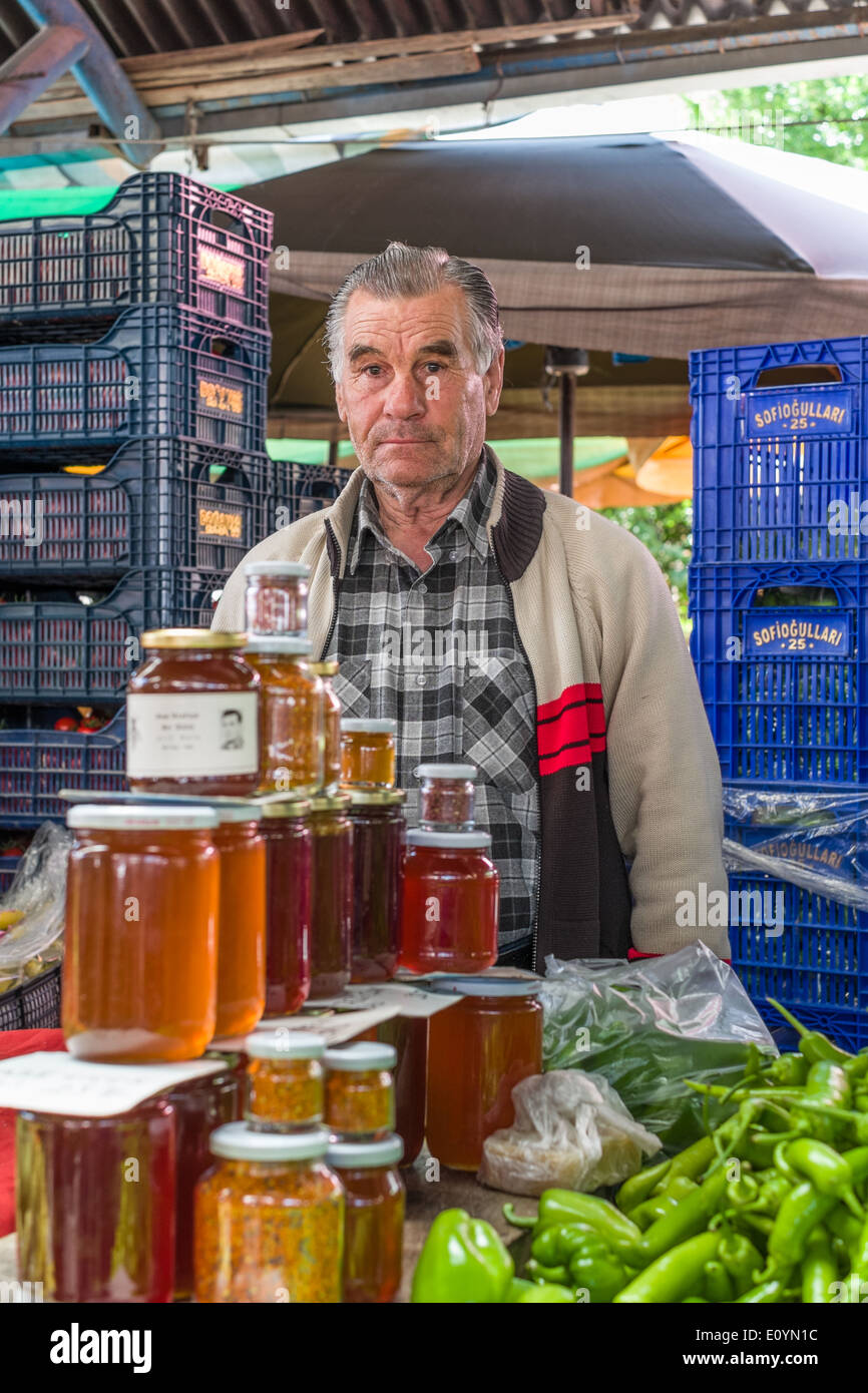 The weekly Tuesday market in Foca, Izmir District, Turkey, stall holder ...