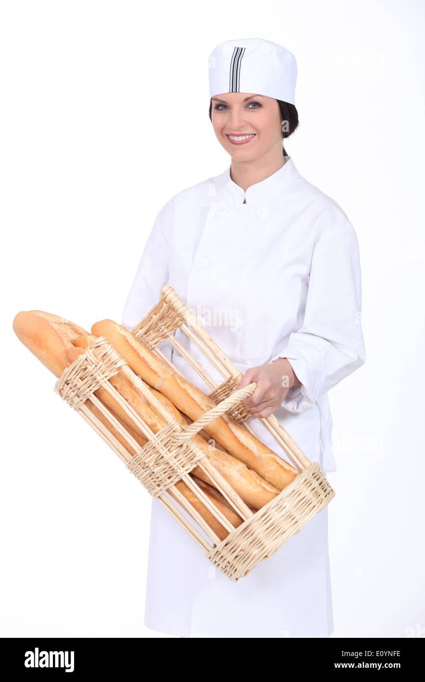 Bakery worker with freshly baled bread Stock Photo - Alamy