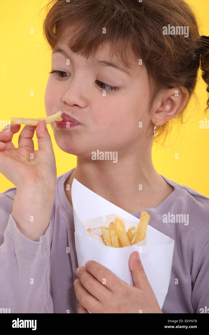 Girl eating Chips Stock Photo - Alamy