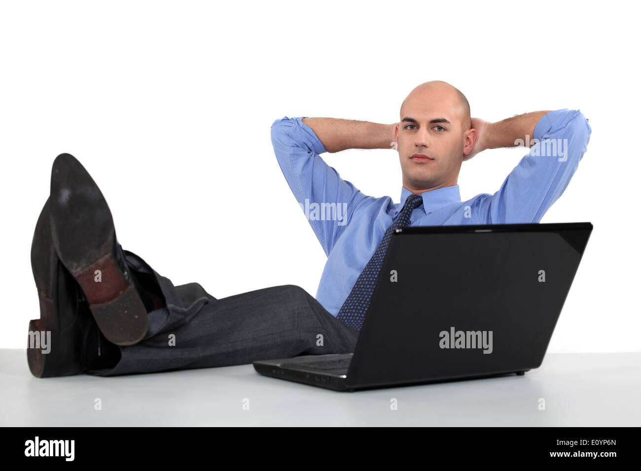Executive putting his feet up Stock Photo - Alamy