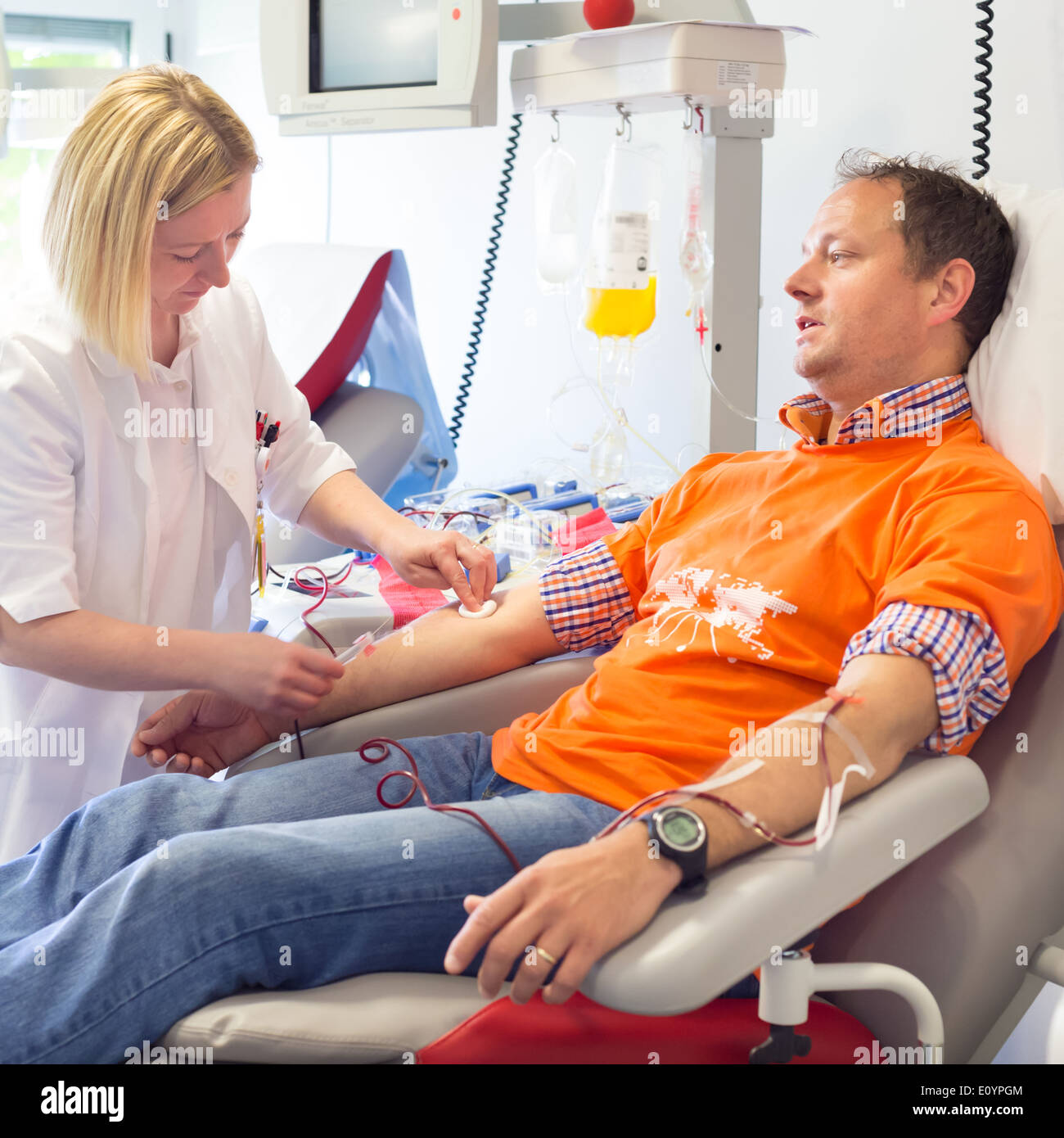 Blood donor at donation Stock Photo - Alamy