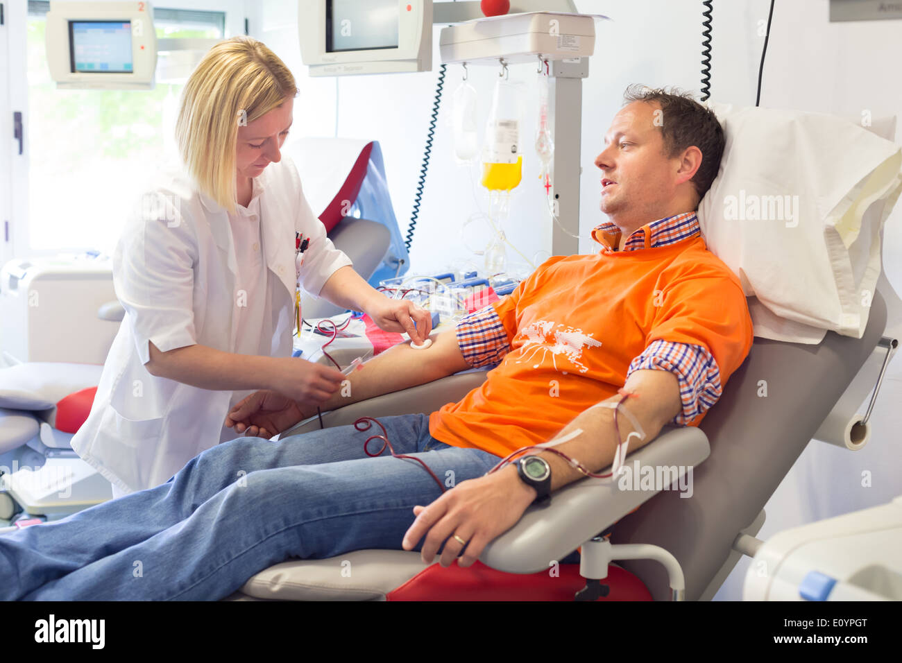 Blood donor at donation Stock Photo - Alamy