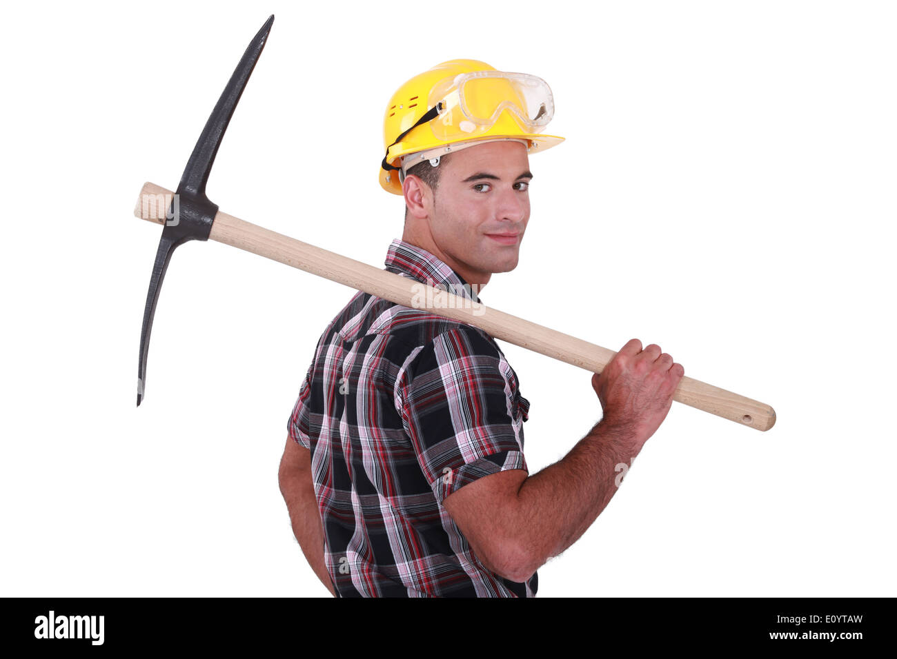 craftsman holding a pick on his shoulder Stock Photo - Alamy