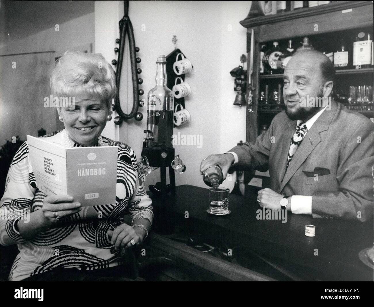 Jun. 06, 1971 - AT the bar, Dr. Ratz pours a drink for his wife who is ...