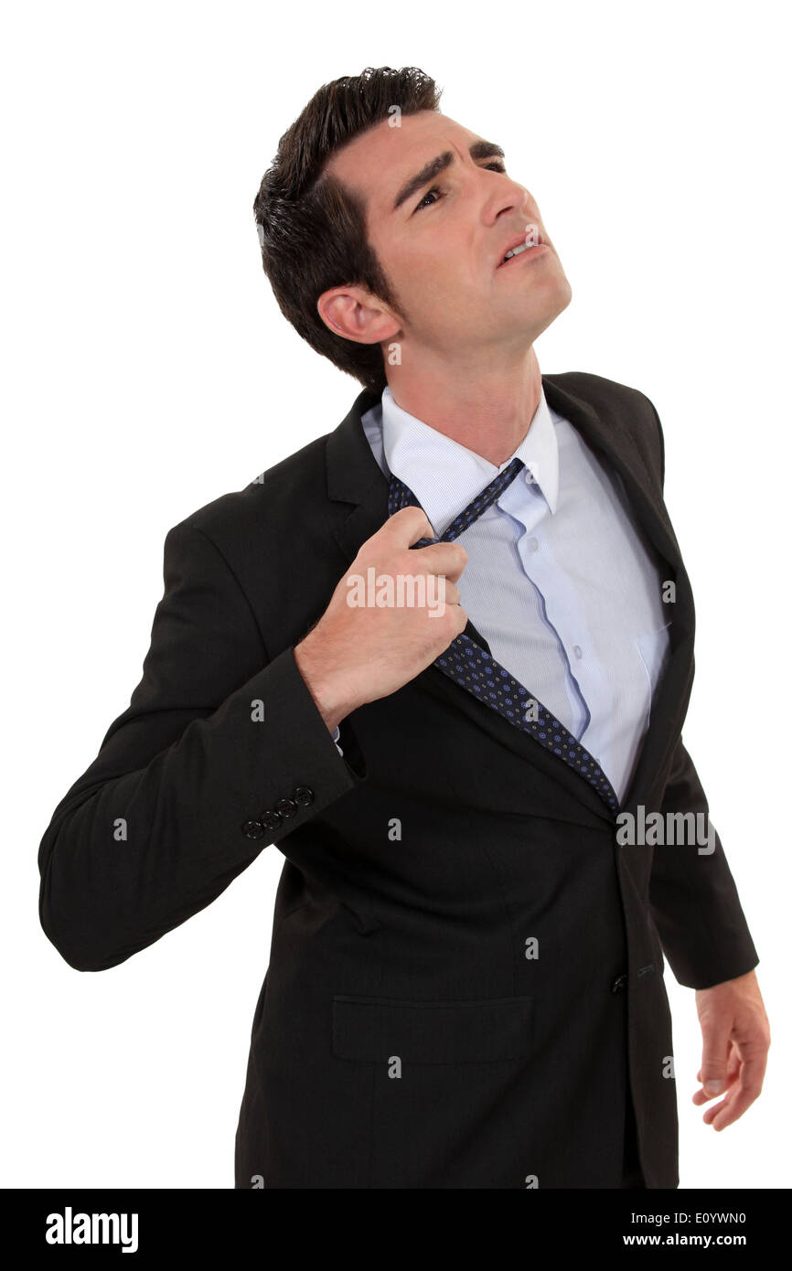 Man loosing tie Stock Photo - Alamy