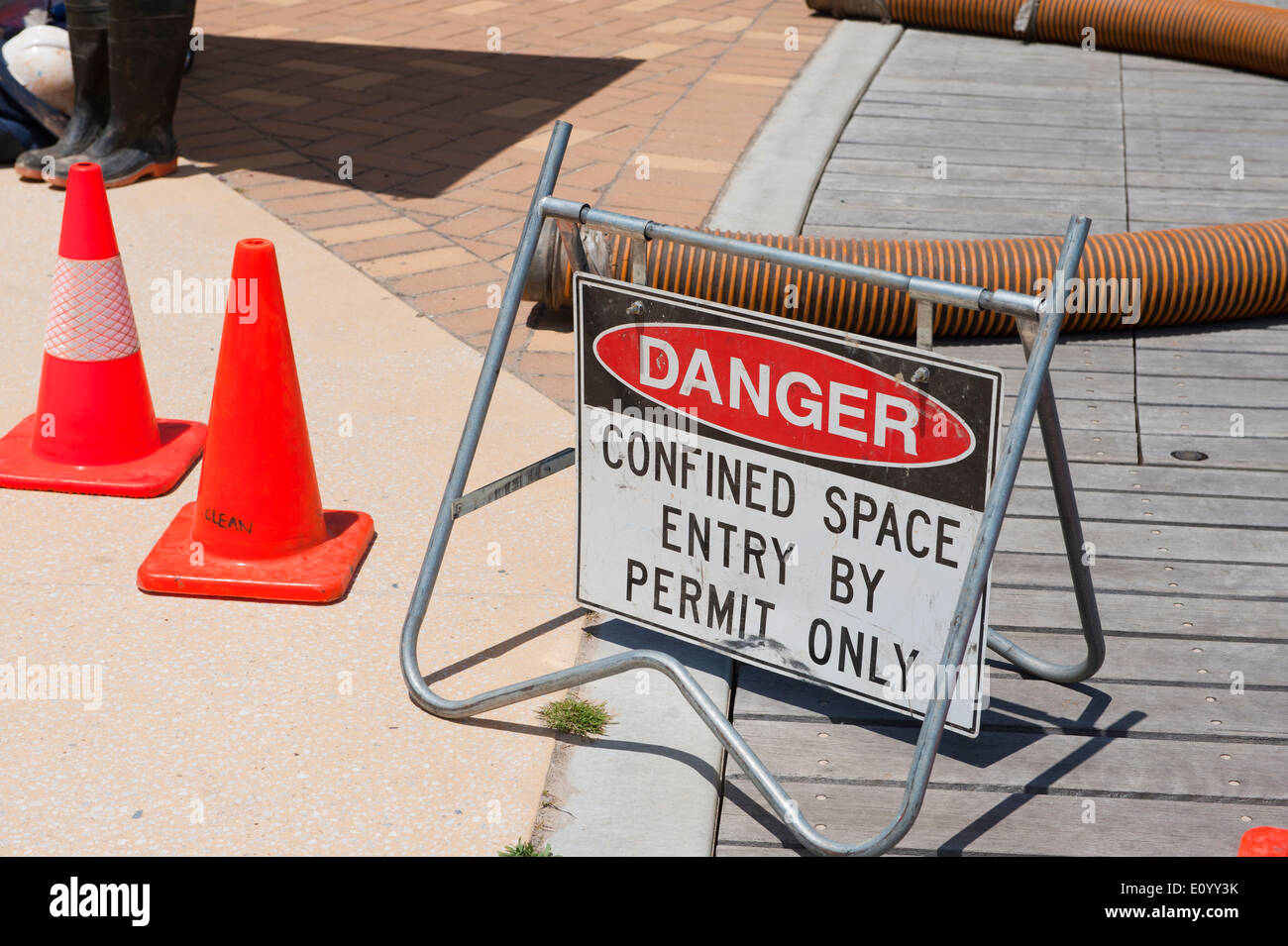 Sign warning of dangerous work underway Stock Photo - Alamy