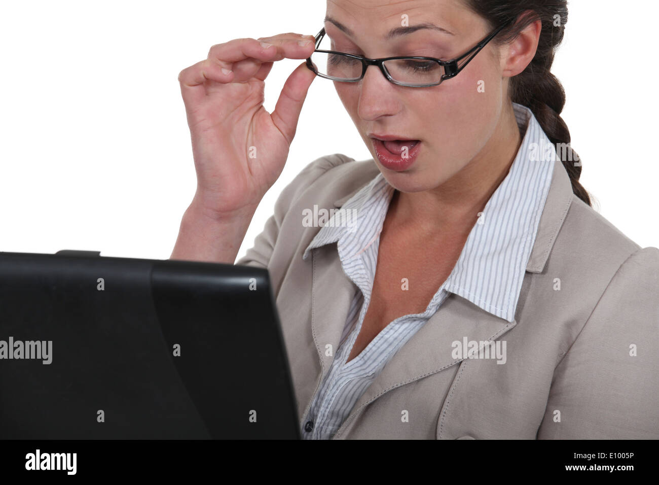 Woman looking in surprise Stock Photo - Alamy