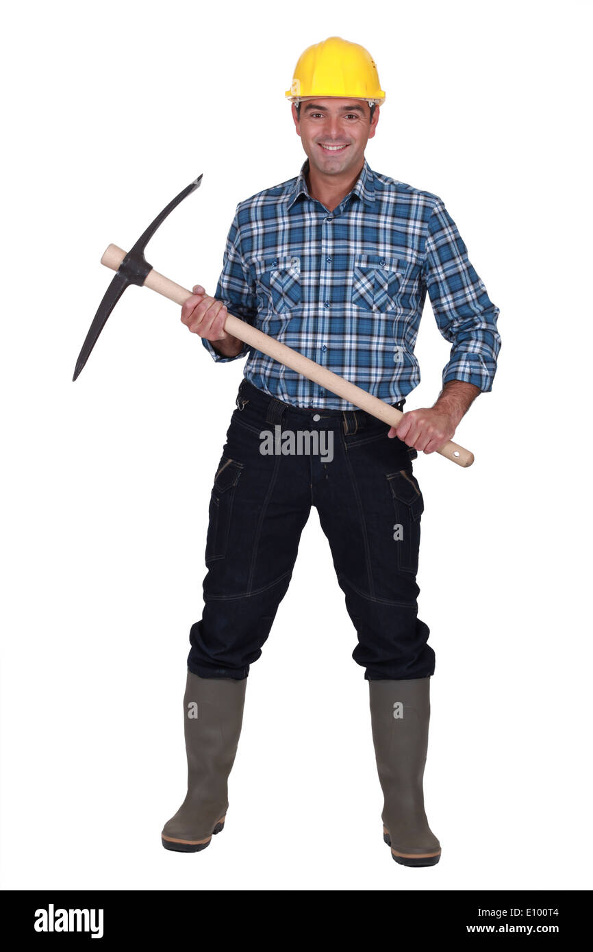 craftsman holding a pick Stock Photo - Alamy